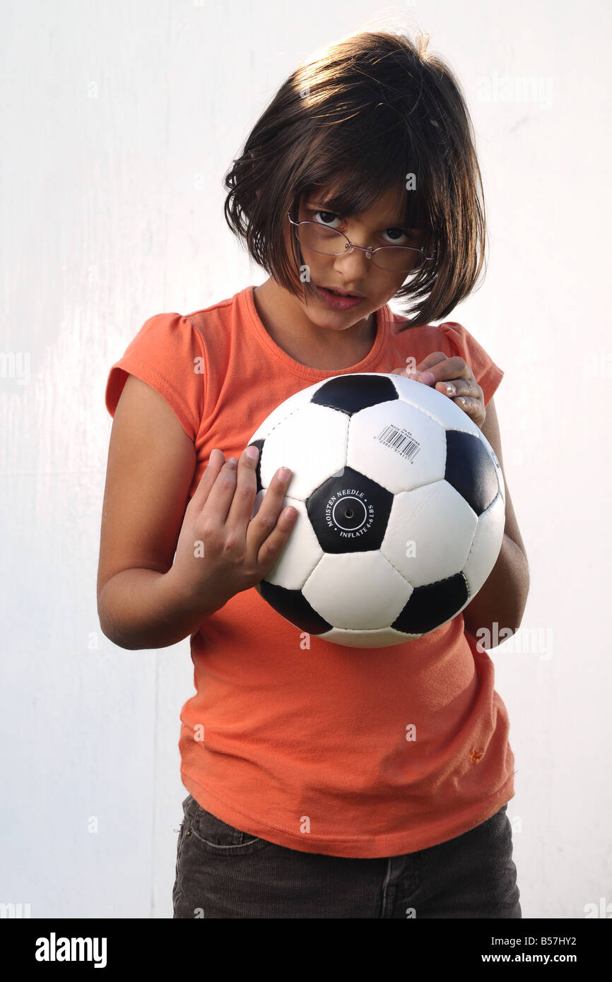 Girls playing football one girl hi-res stock photography and images - Alamy