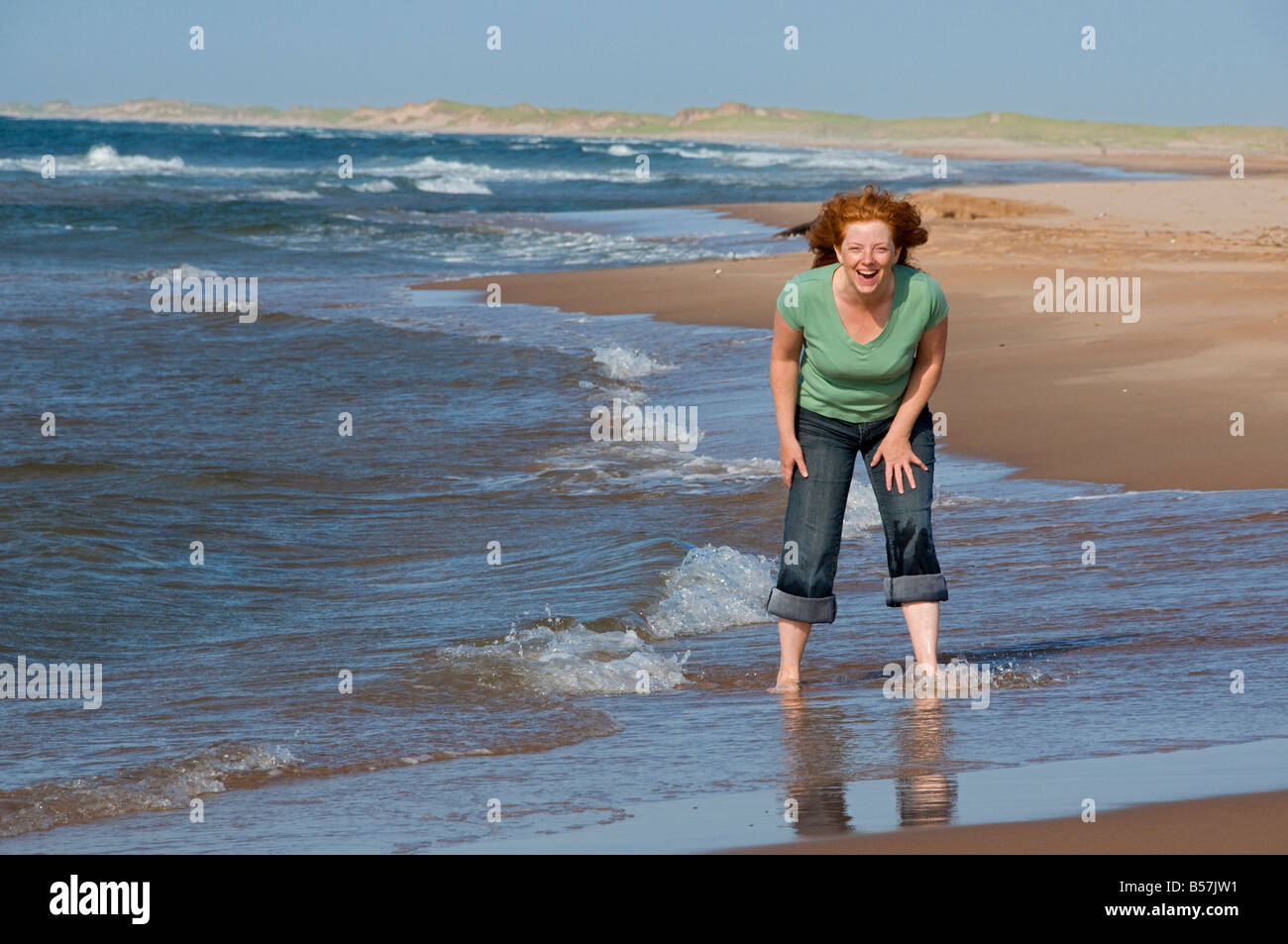 Happy woman at the beach Stock Photo - Alamy