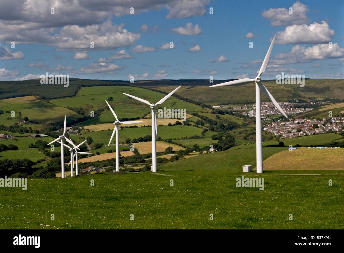 Taff Ely Wind Farm on hillside above housing estate near Tonyrefail ...