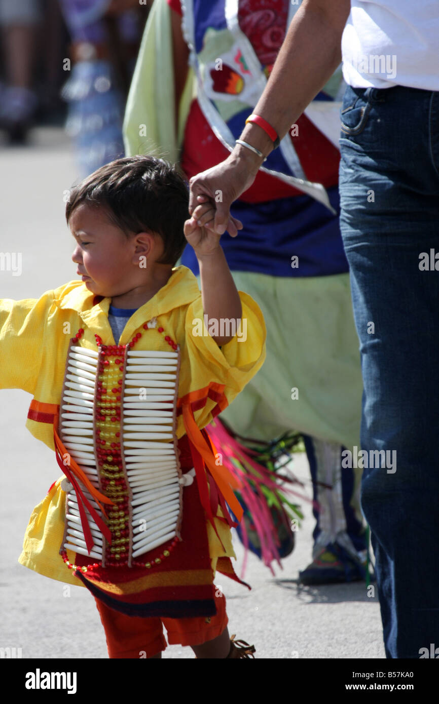 A young Native American boy dressed to dance at a Pow Wow at the ...