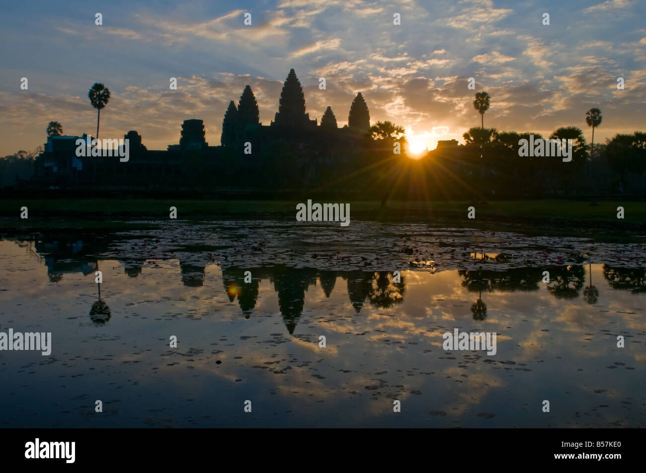 Angkor Wat across Reflecting Pool with Clouds Backlit at Sunrise Siem ...