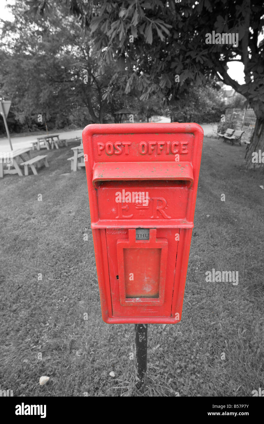 a red post box in a rural village Stock Photo - Alamy