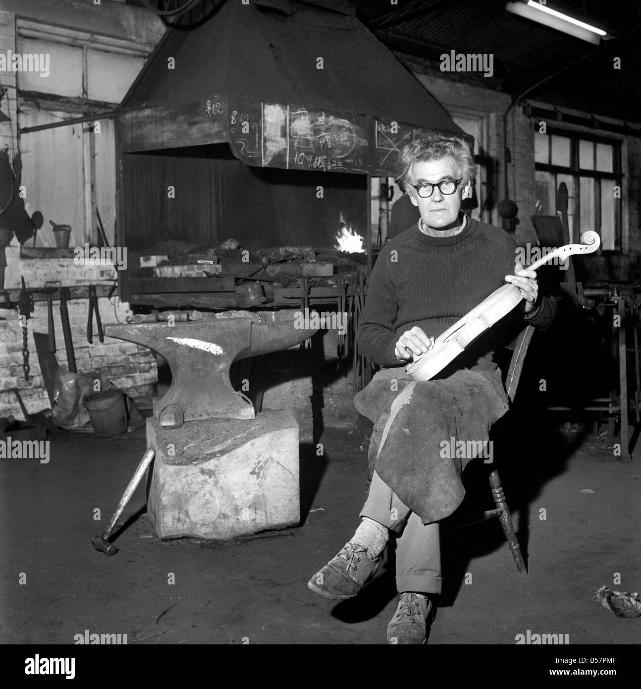 Mr. Harry Horrobin playing his violin outside. January 1975 75-00196 ...
