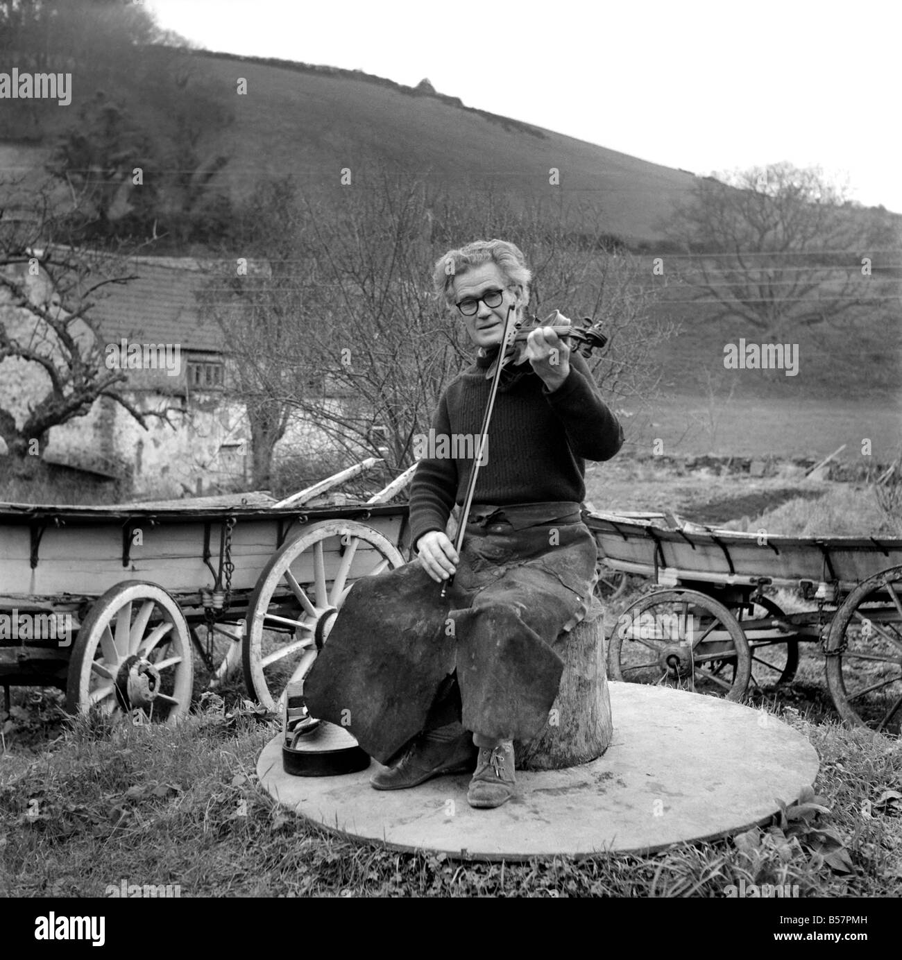 Mr. Harry Horrobin playing his violin outside. January 1975 75-00196 ...
