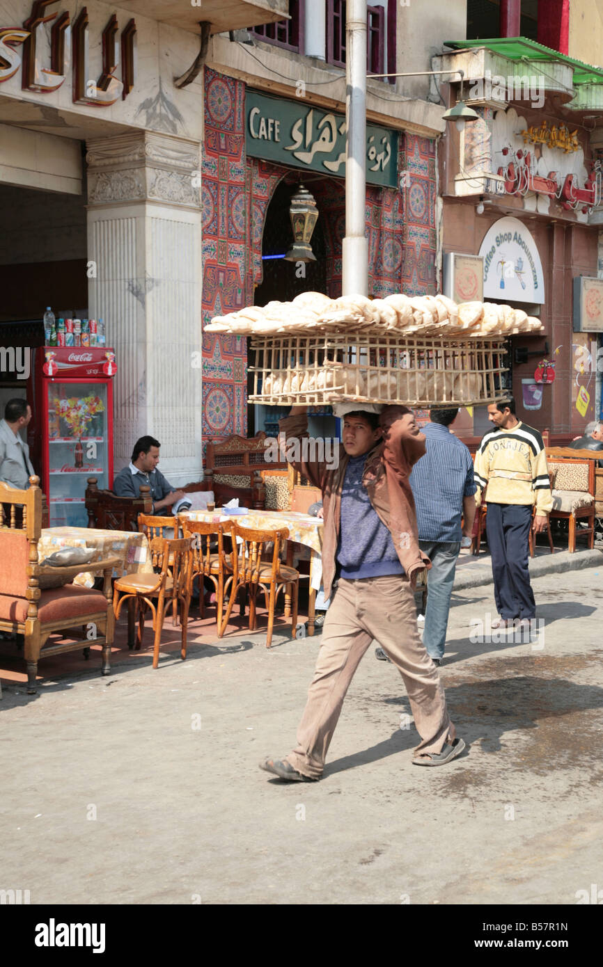 Man carrying bread, Alazhar Square, Cairo, Egypt, North Africa, Africa ...