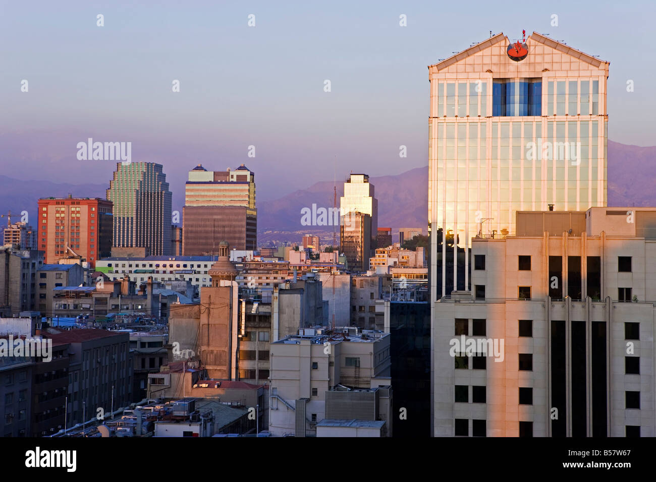 Elevated view of the central city skyline at dusk, Santiago, Chile ...
