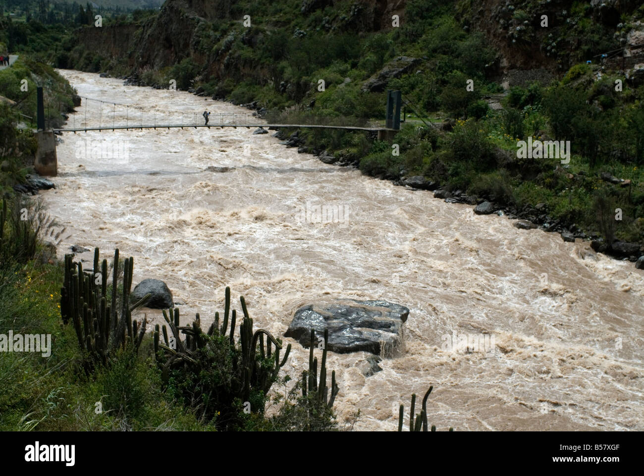 Backpacker crossing river on bridge hi-res stock photography and images ...