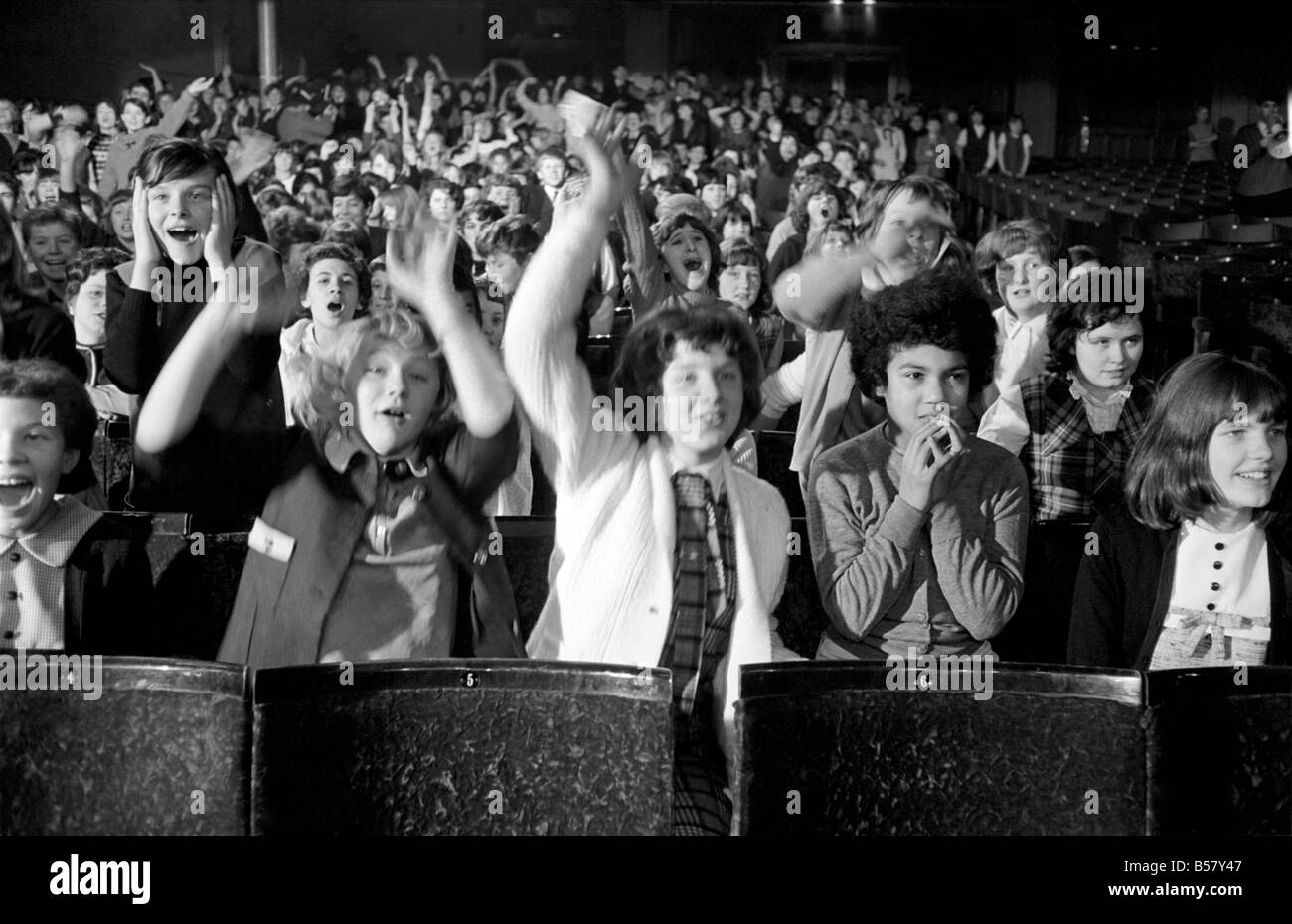 Fans screaming during a Beatles concert in their hometown of Liverpool ...