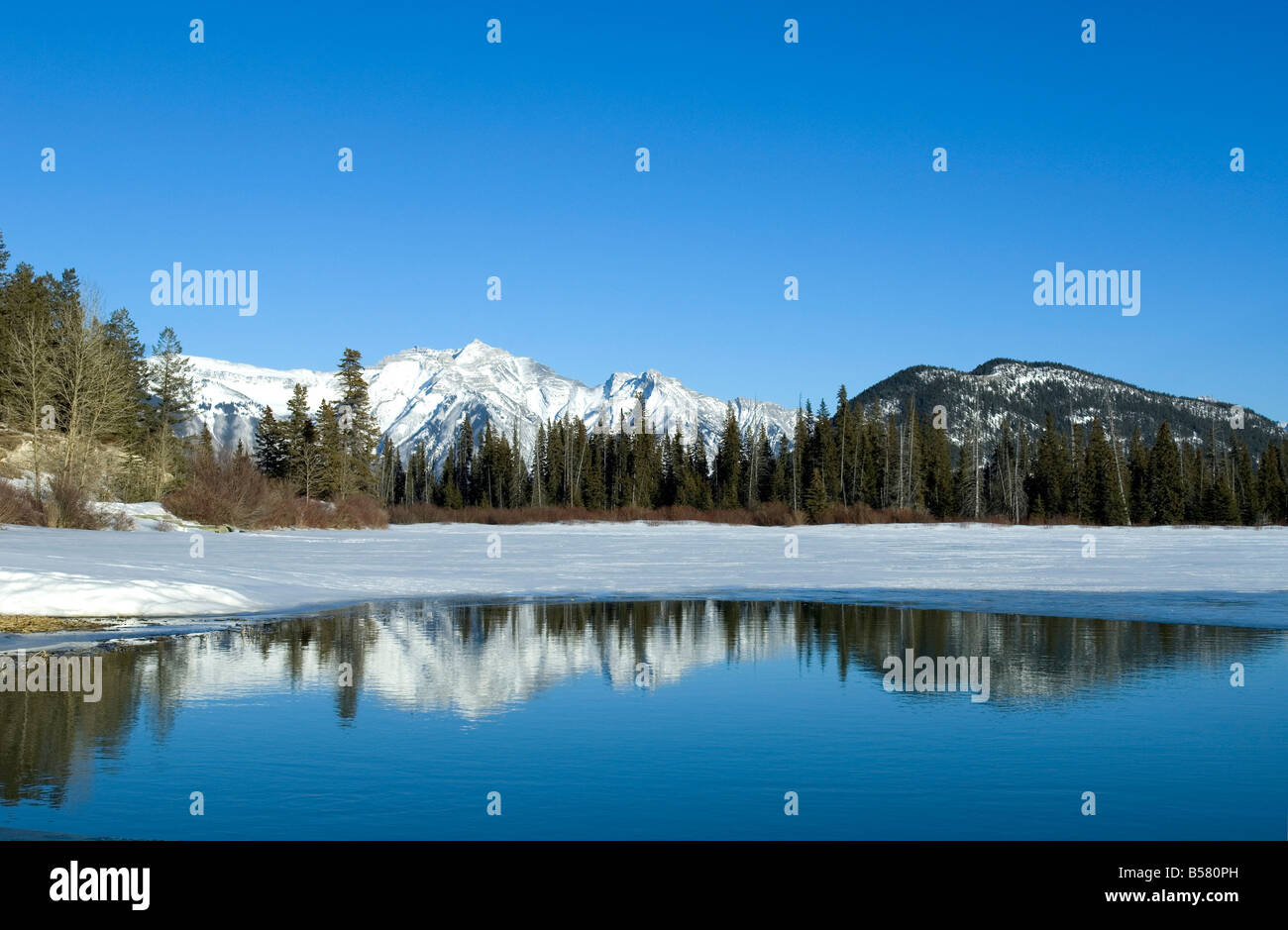 Reflection of Rocky Mountains in Vermilion Lakes in Banff National Park ...