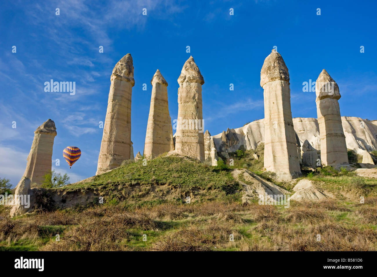 Hot air balloon over the phallic pillars known as fairy chimneys in the ...