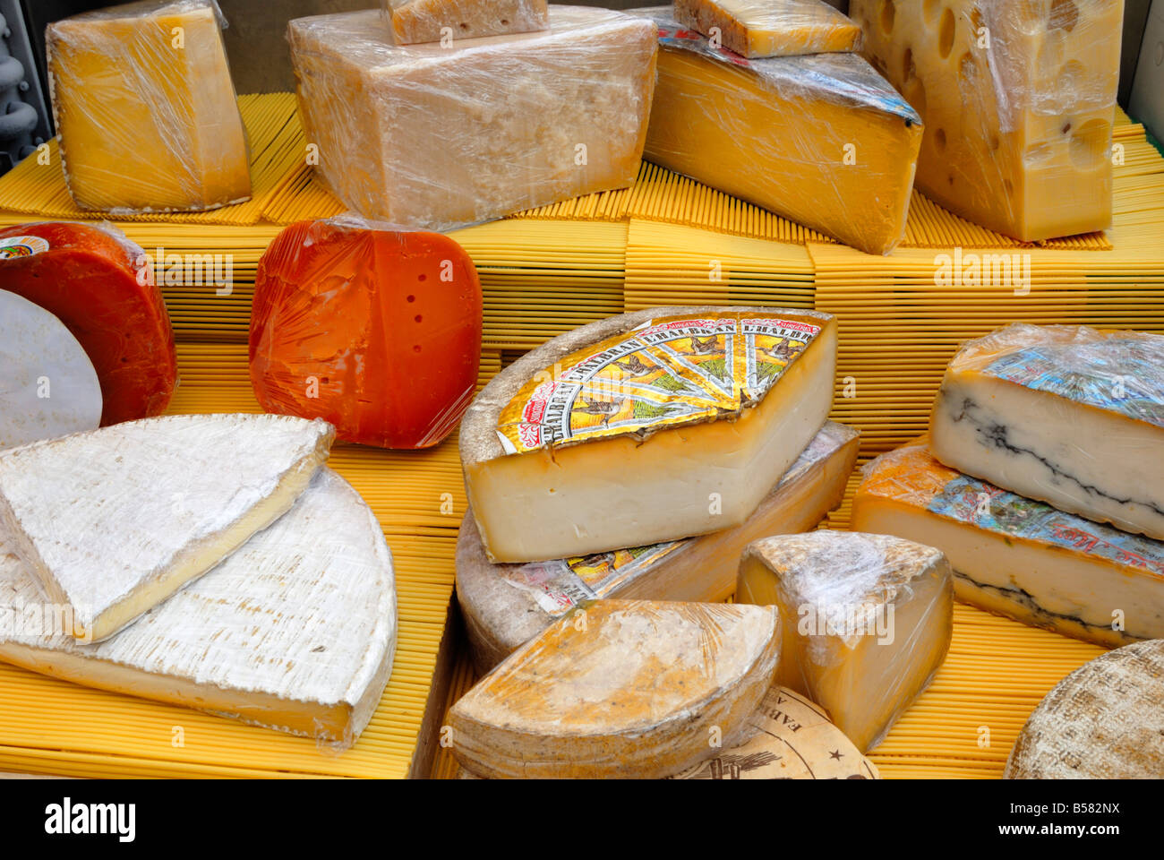 Assorted French cheeses on a market stall, La Flotte, Ile de Re ...