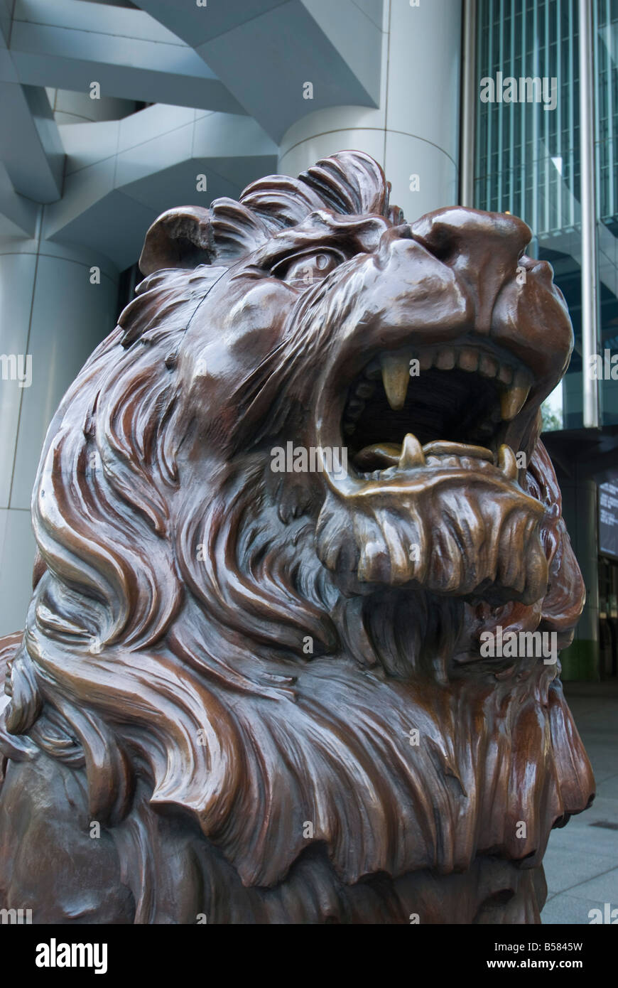 Bronze lion statue outside the HSBC Bank Headquarters, rubbing its paws ...