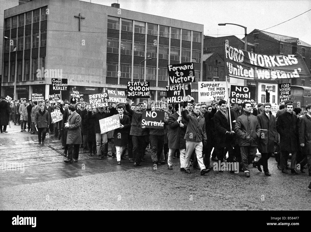 Strikes: Ford Workers on strikes march outside the Hailwood Factory ...