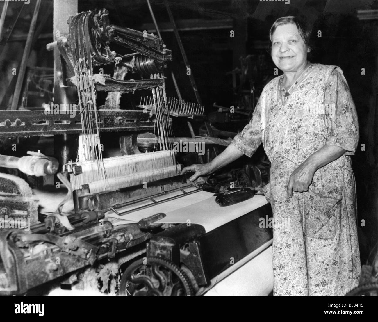 Mrs. Clara Abbott (70), at work on her loom in the cotton mills. April ...