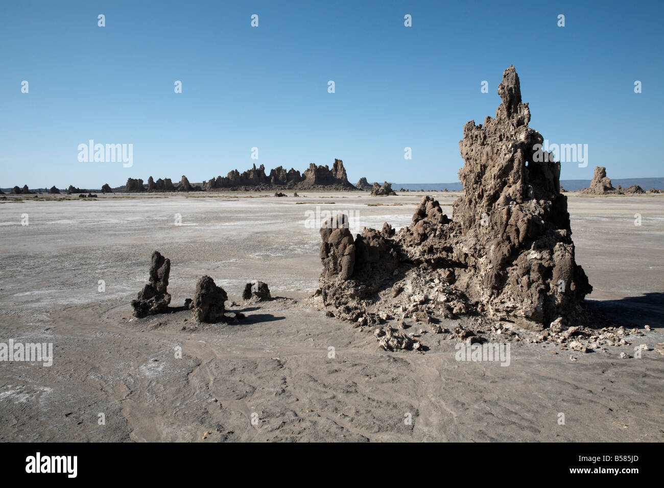 The desolate landscape of Lac Abbe, dotted with limestone chimneys ...