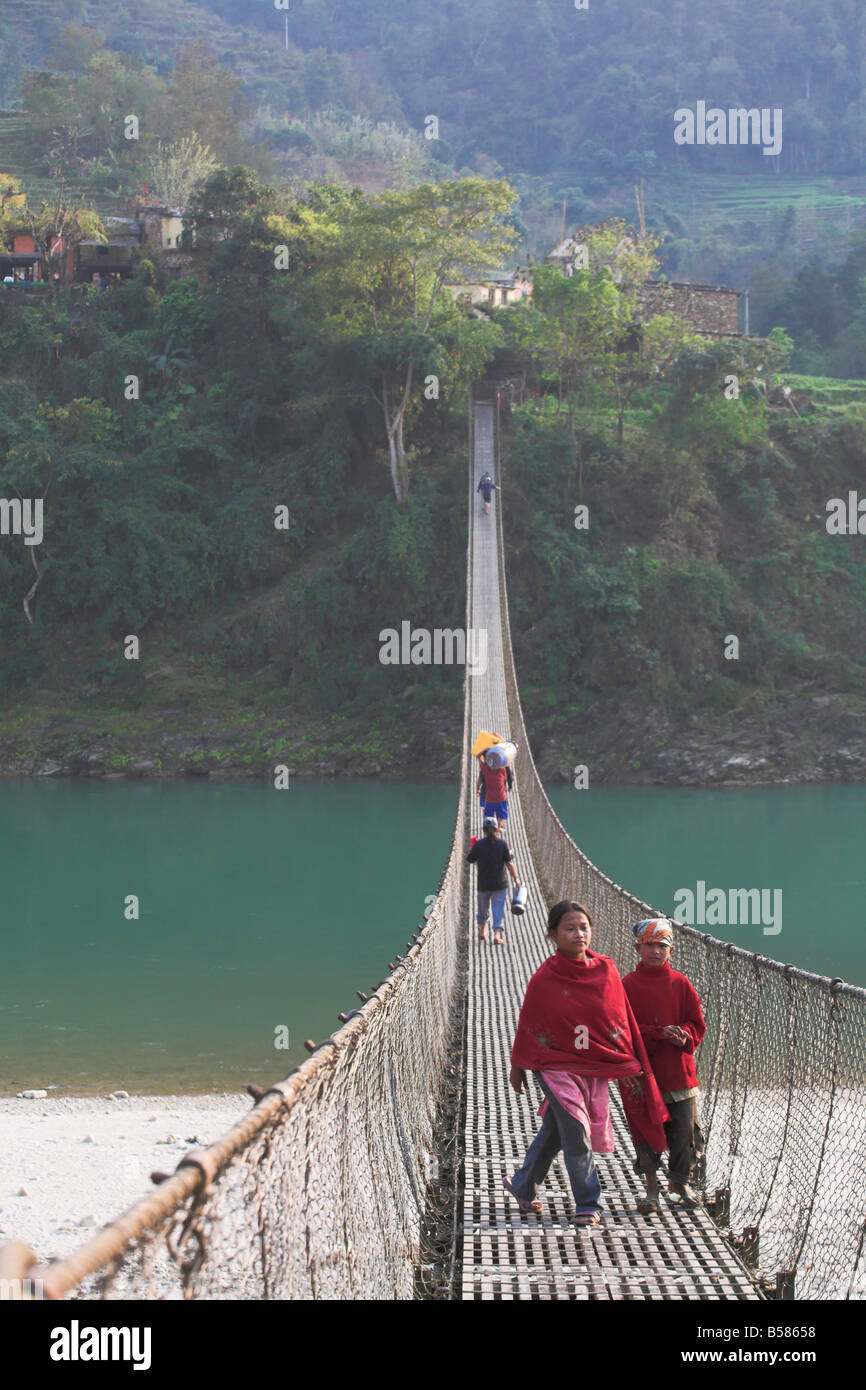 Local people crossing the 160m long suspension bridge, Trisuli Center ...