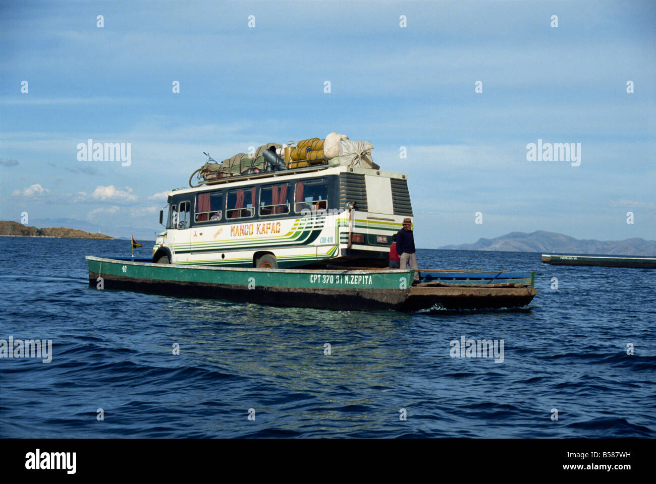 Minibus crossing Lake Titicaca on a ferry in Bolivia South America C ...