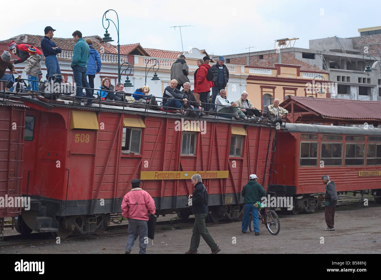 Tourists await the departure of the train ride to Nariz del Diablo ...