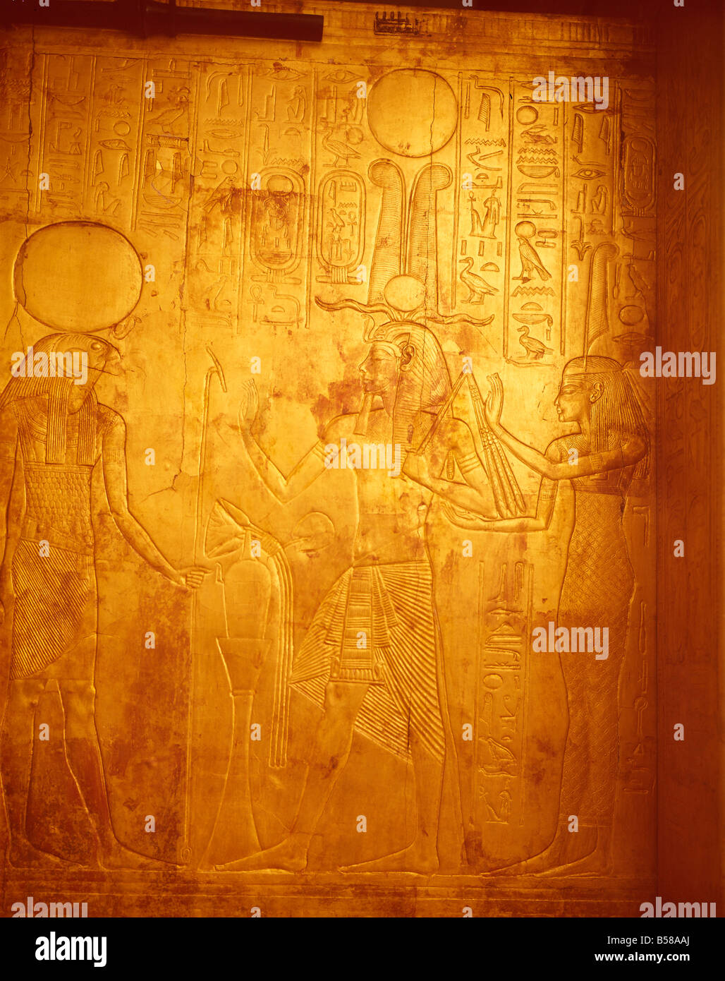 Detail of the king wearing Osiris crown with gods Reherakte and Maat on ...