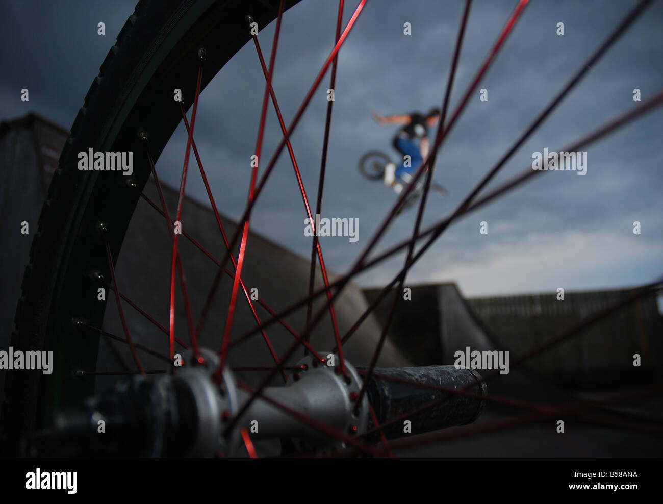 A BMX rider doing a stunt at wooden waves skatepark Stock Photo - Alamy