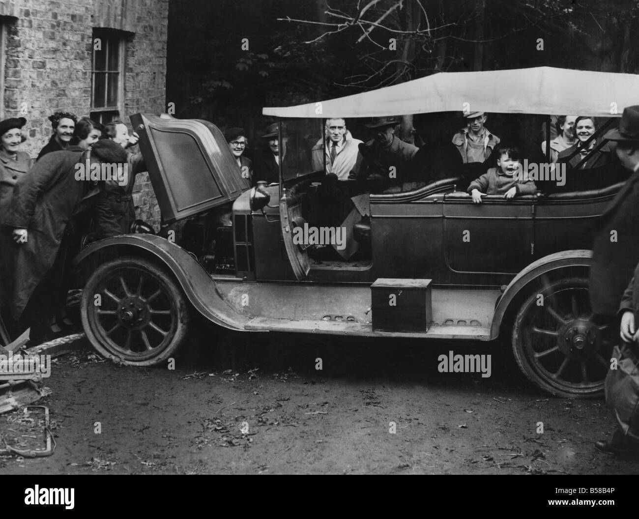 Picture shows crowds examining a 1910 Arrol Johnston 13.9 h.p. car ...