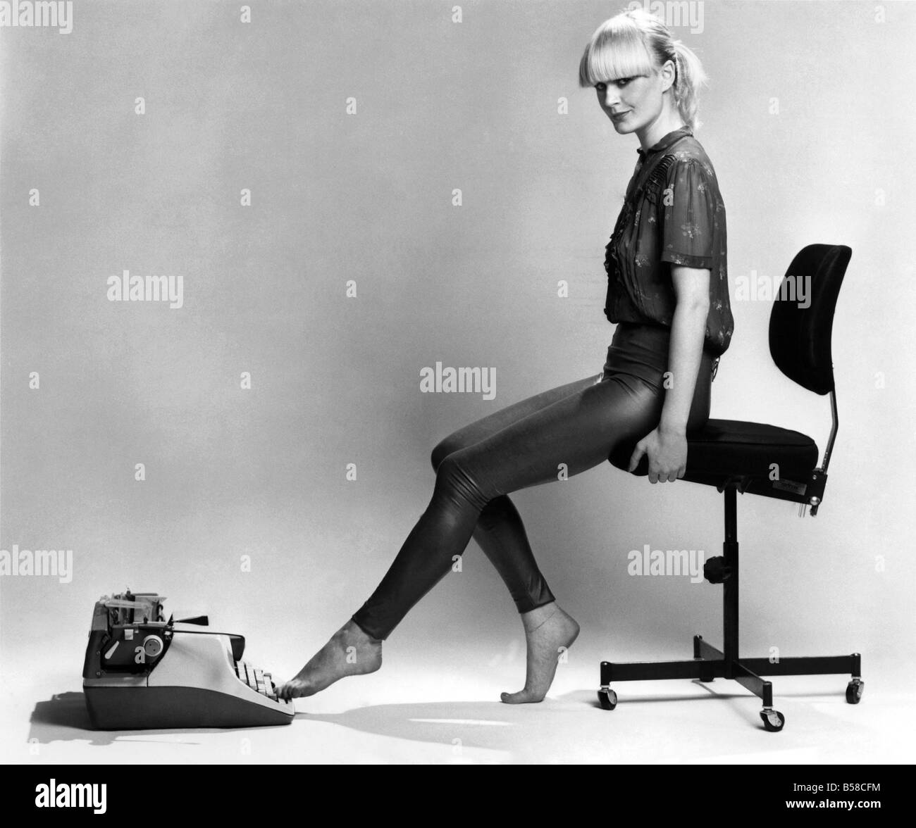 The Typewriter:- Using portable typewriter, place on floor. Place heel ...