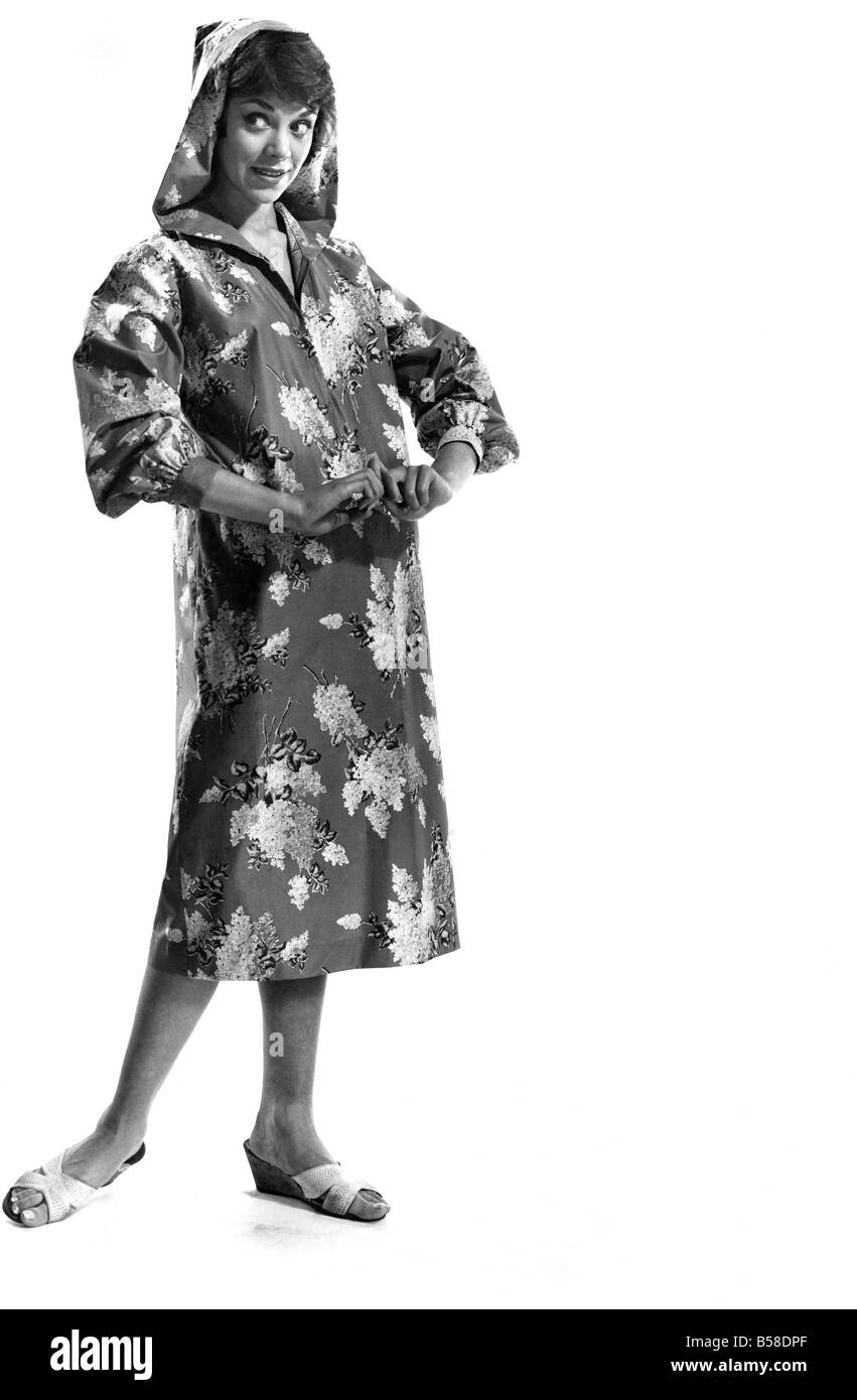 Reveille Fashions. Model wearing floral pattern hooded rain coat. April ...