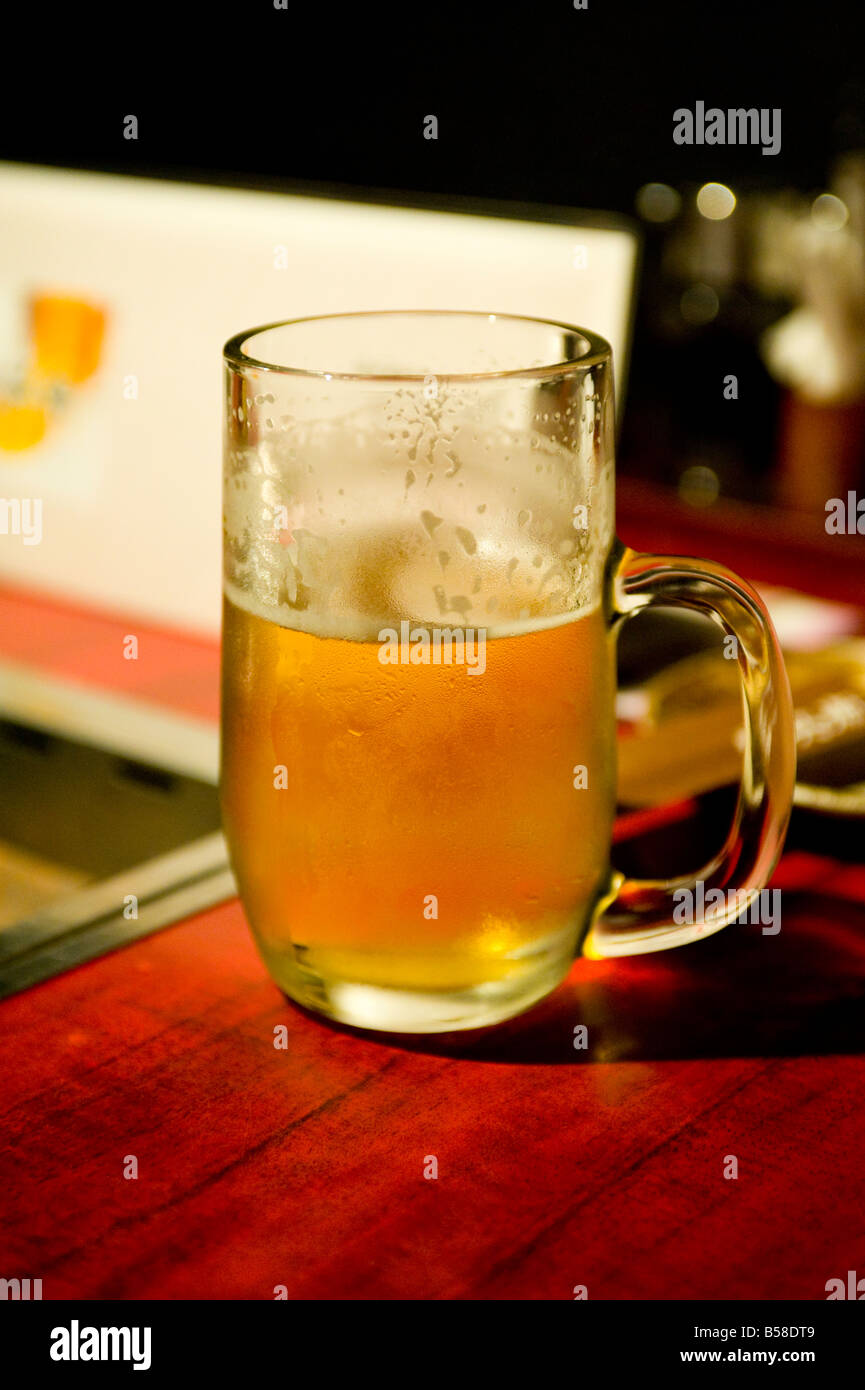 A cold beer in a Yakitori restaurant in the Shibuya district in Tokyo ...