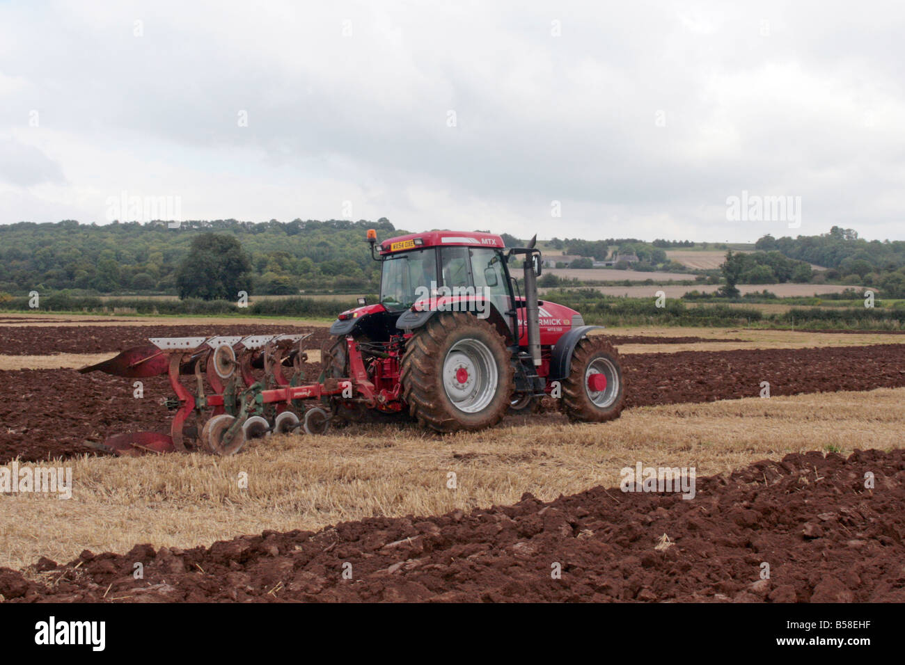 A farmer plowing a field during a ploughing match at Mells, Somerset ...