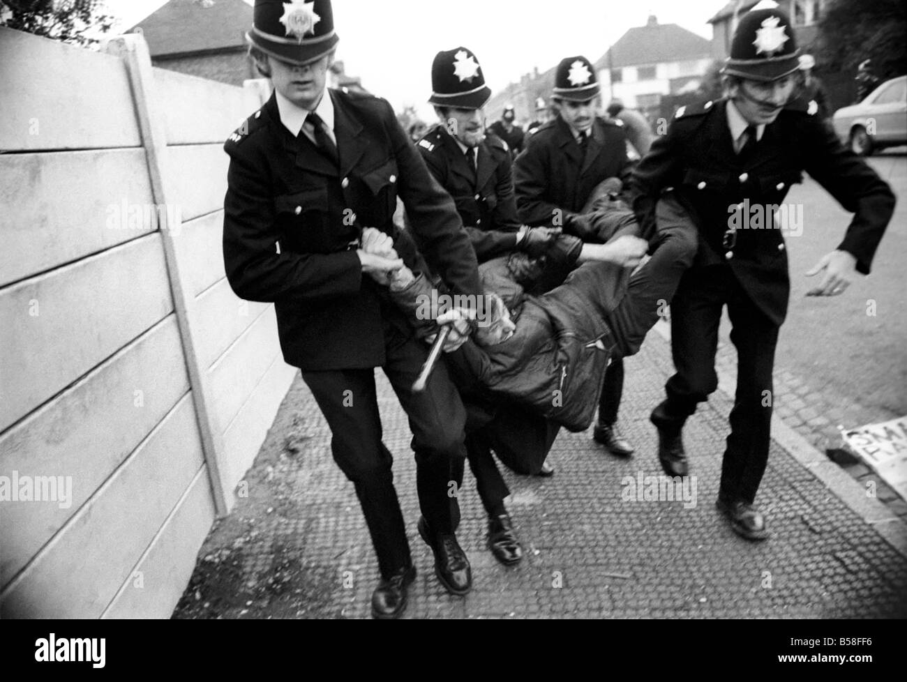 The Birmingham Riots. A demonstrator is carried away by police after ...