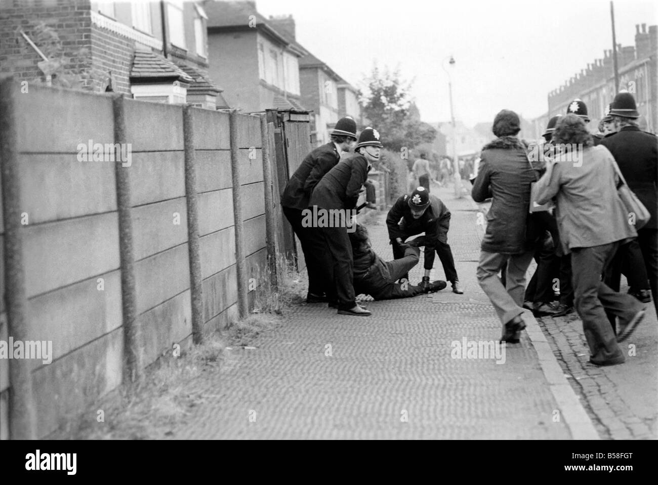 The Birmingham Riots. A demonstrator "in the arms of the Law" at ...