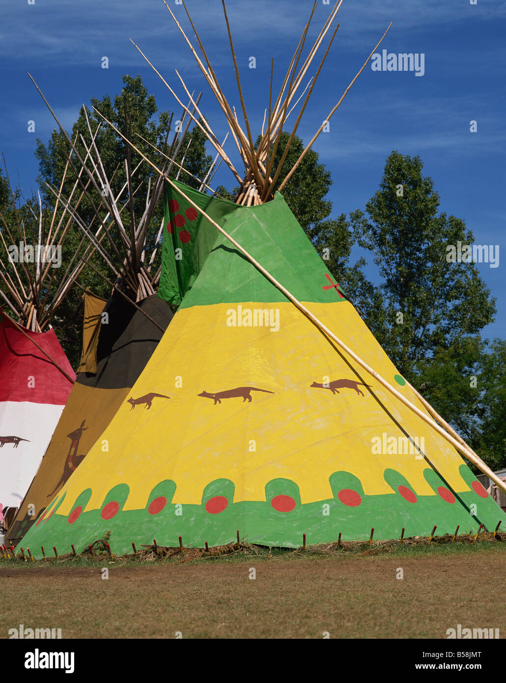 Brightly coloured decorated tepees of North American Indians in Canada ...