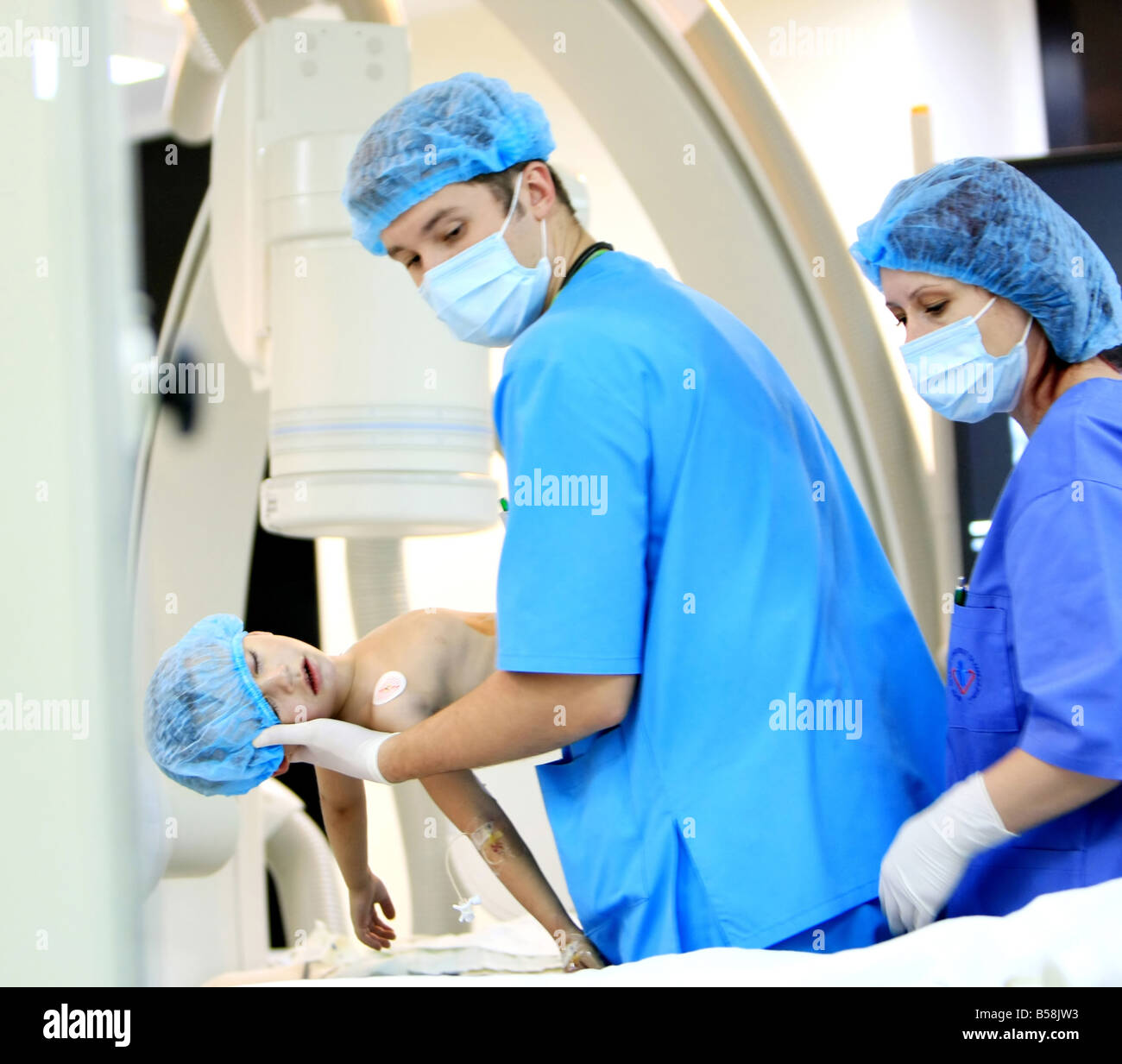 Doctor take care of a boy at operating room Stock Photo - Alamy