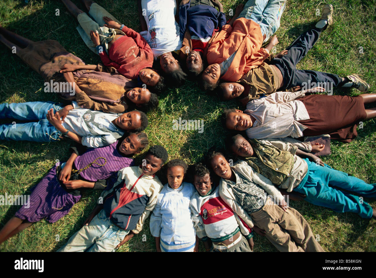 Street kids lying in star formation, Addis Ababa, Ethiopia, Africa ...