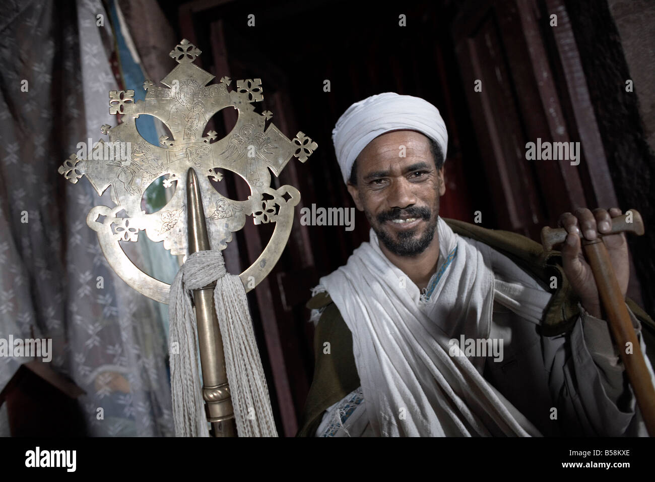 A priest stands in the rock-hewn church of Bet Merkorios, in Lalibela ...