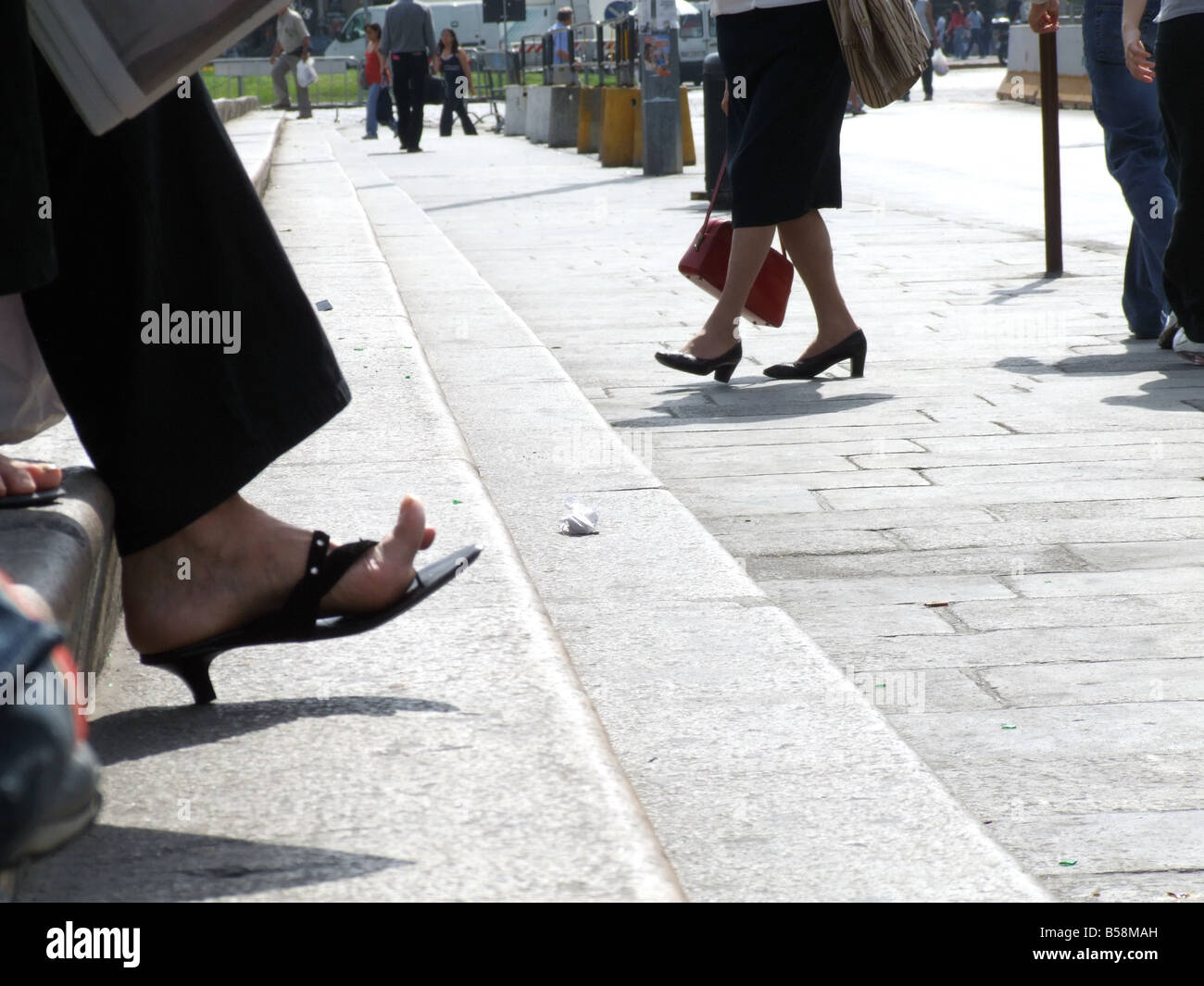 one person walking in street in city town Stock Photo - Alamy