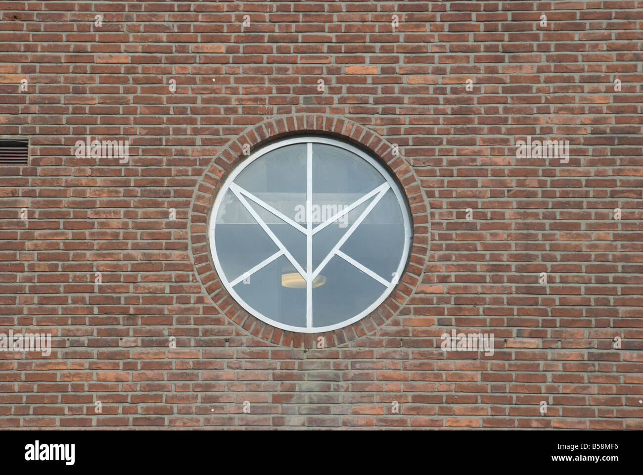Round window of red brick building at the old Fornebu Airport in Oslo ...
