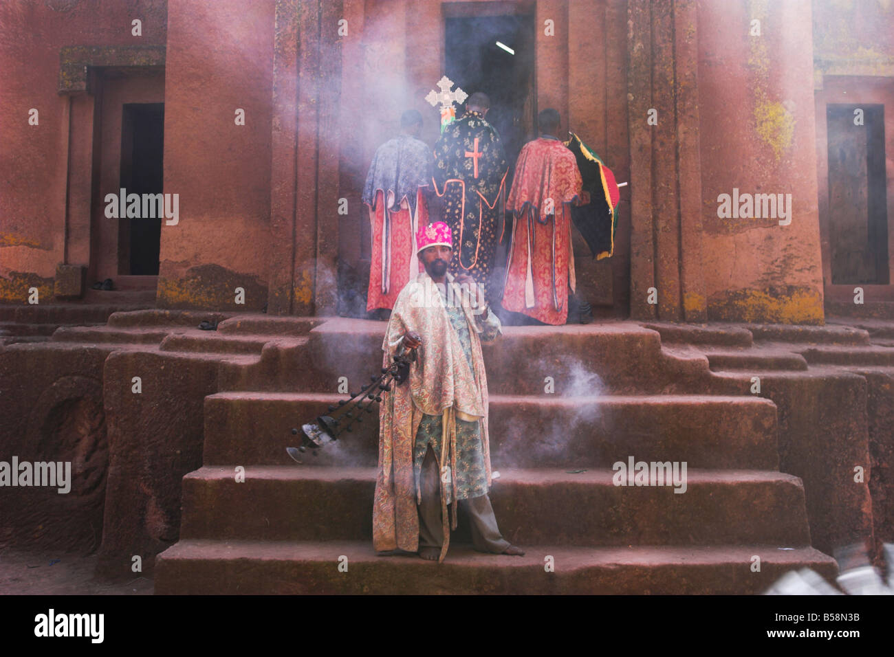 Priest swings an incense burner, church of Bet Giyorgis (St. George's ...