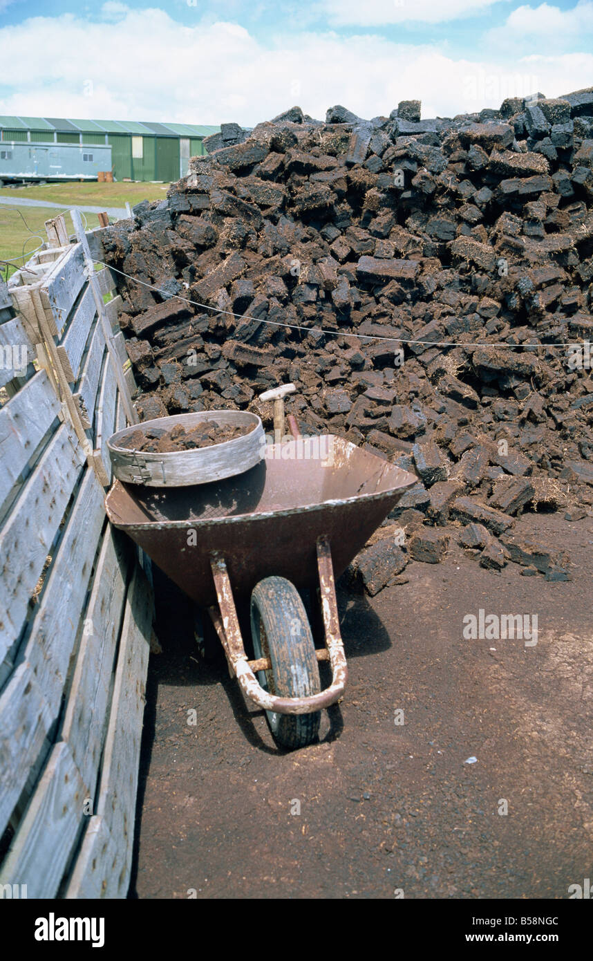 Wheelbarrow and peat stack at a settlement on the Falkland Islands G ...