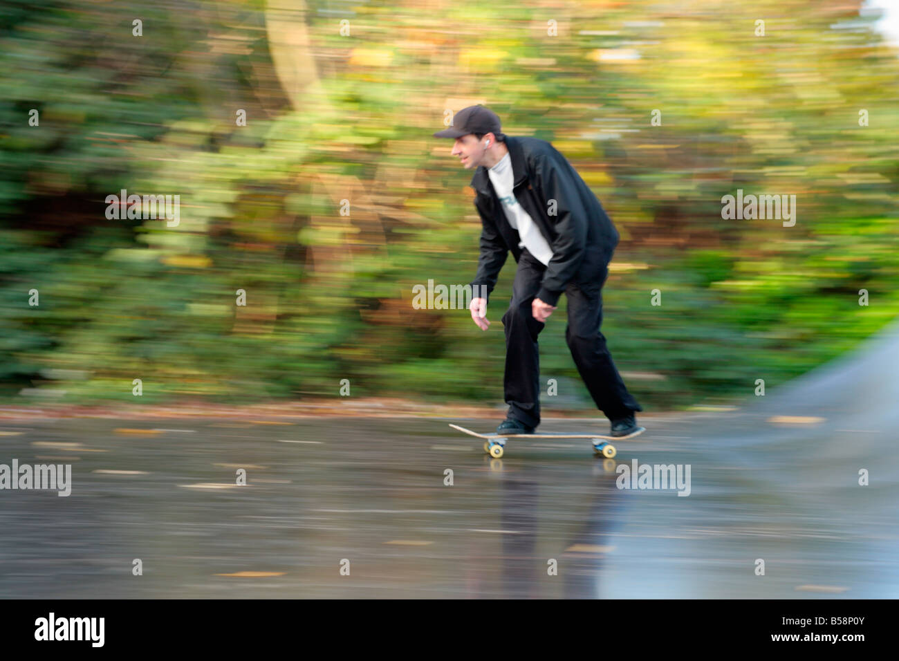 young man skating with his skateboard Stock Photo - Alamy