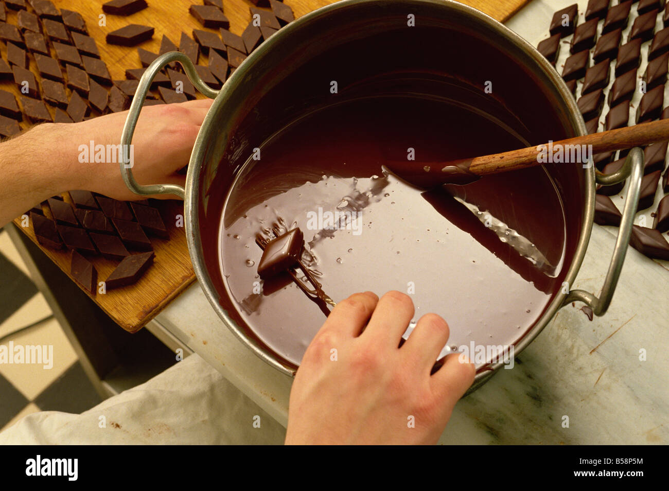 Chocolates hand hi-res stock photography and images - Alamy