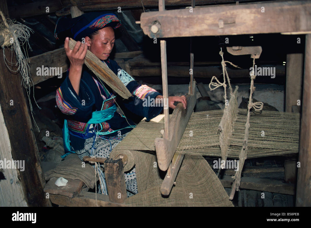 Weaving hemp for mosquito nets Bouyoi village Anshun area Guizhou China ...