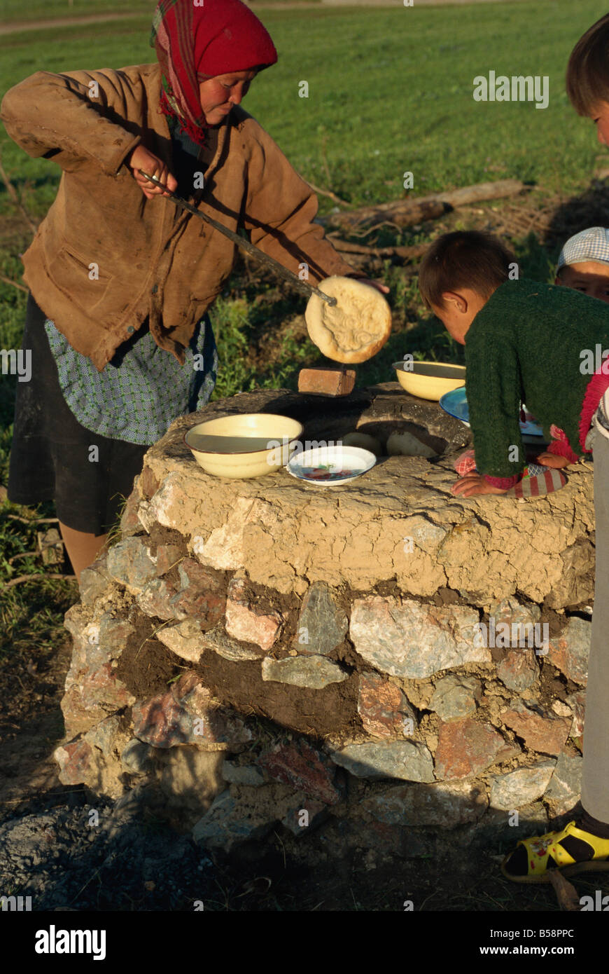 Kazak cooking bread Tianshan Xinjiang China Asia Stock Photo - Alamy