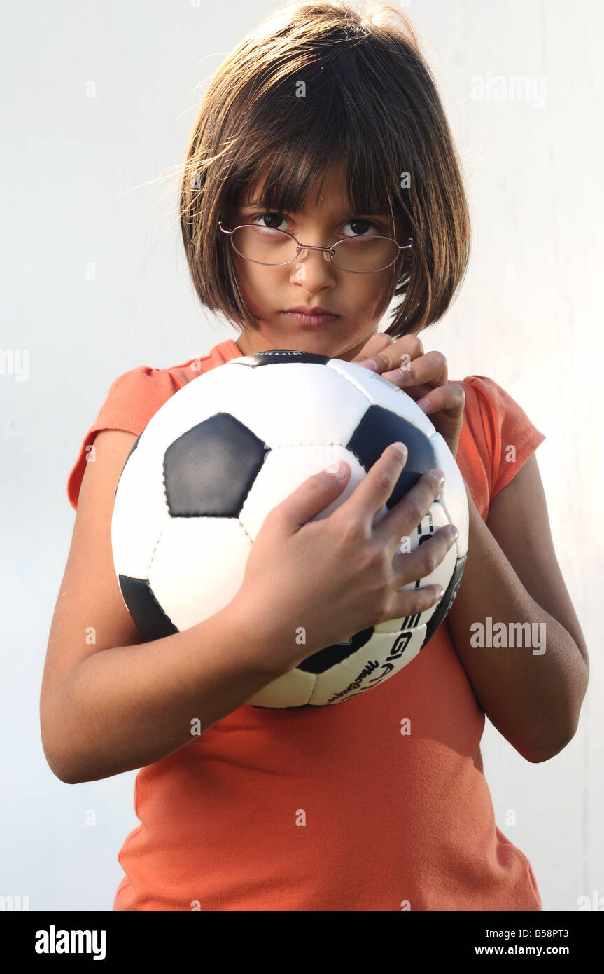 Girls playing football one girl hi-res stock photography and images - Alamy
