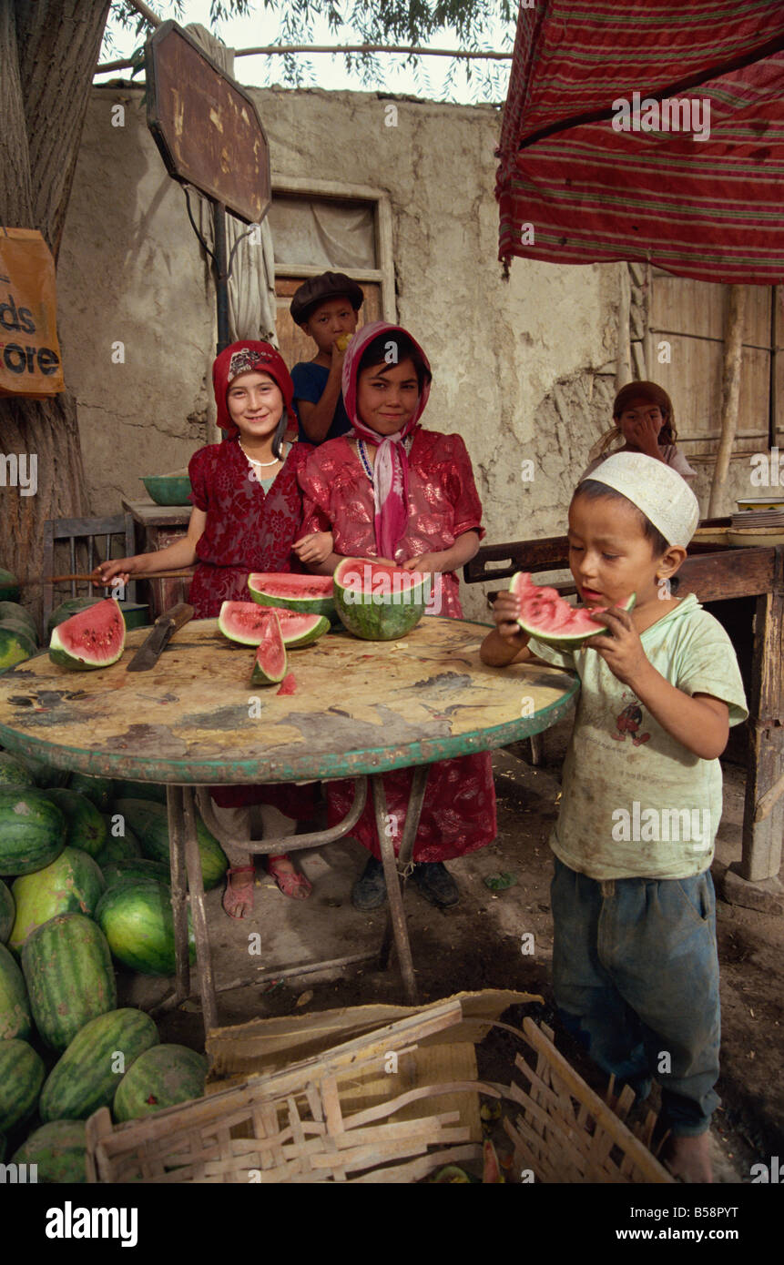 Young girl selling watermelons, Hotan, Xinjiang, China Stock Photo - Alamy