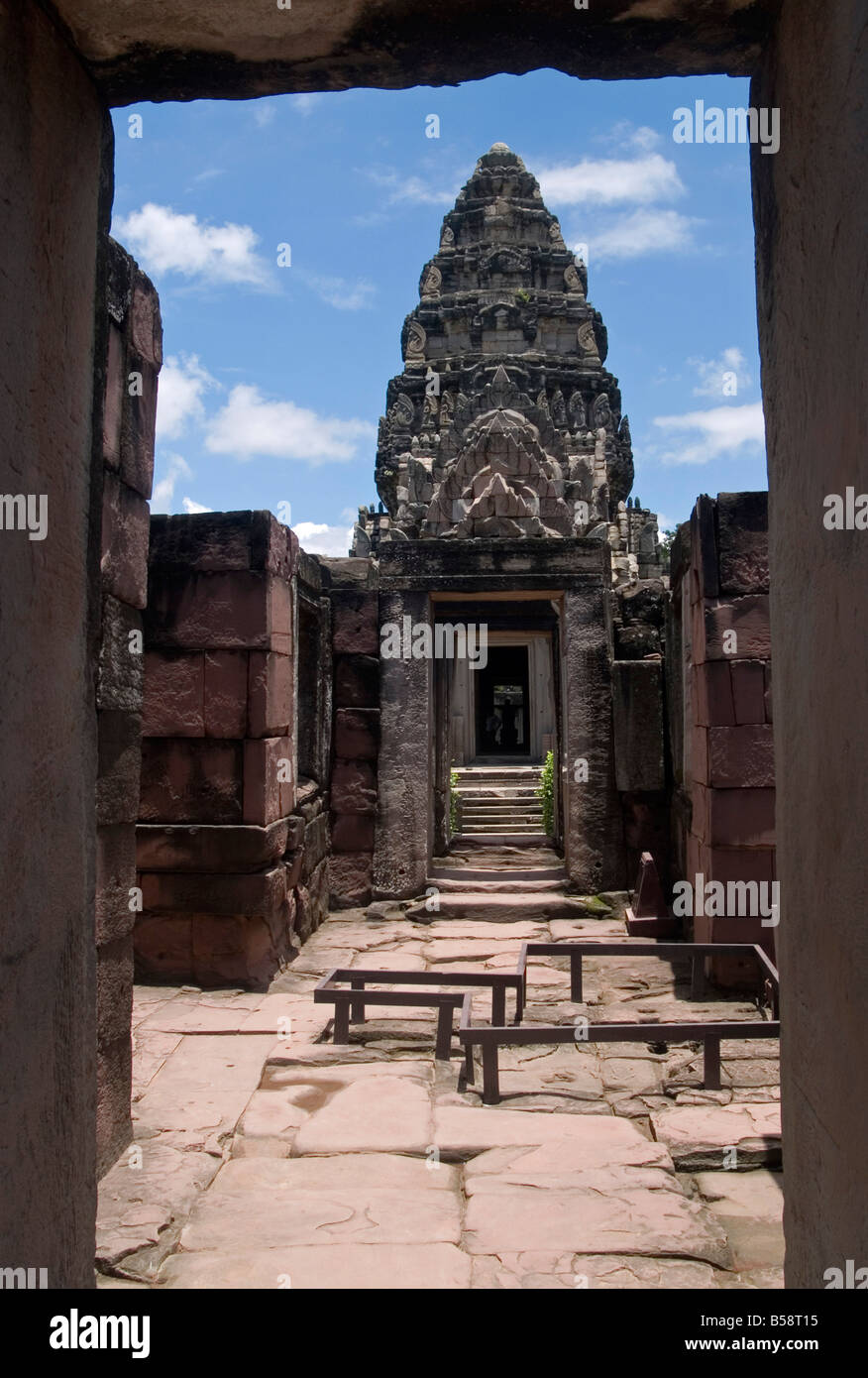 the Khmer temples of Prasat Phimai in Thailand seen through a doorway ...