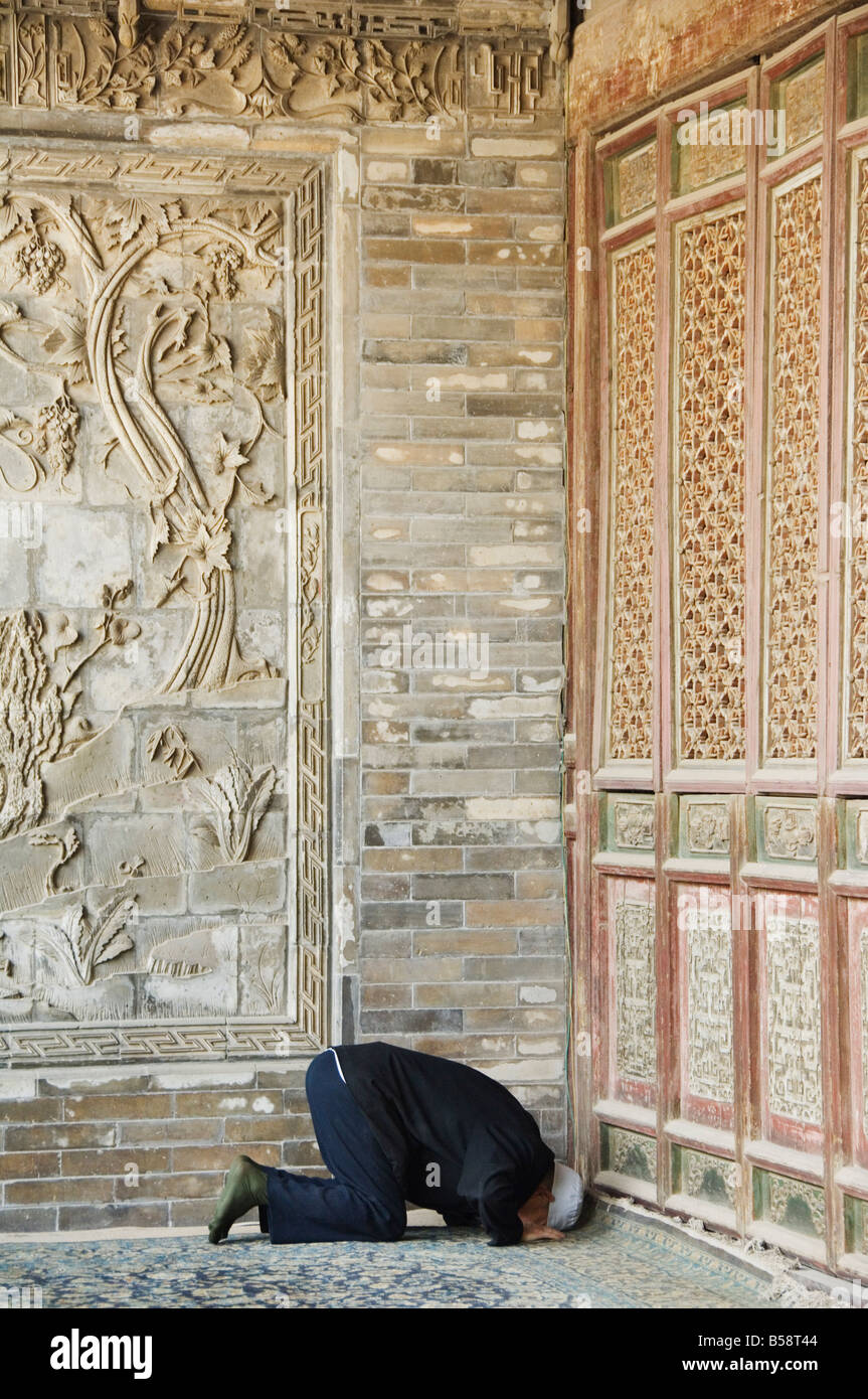 Man praying at The Great Mosque located in the Muslim Quarter, home to ...