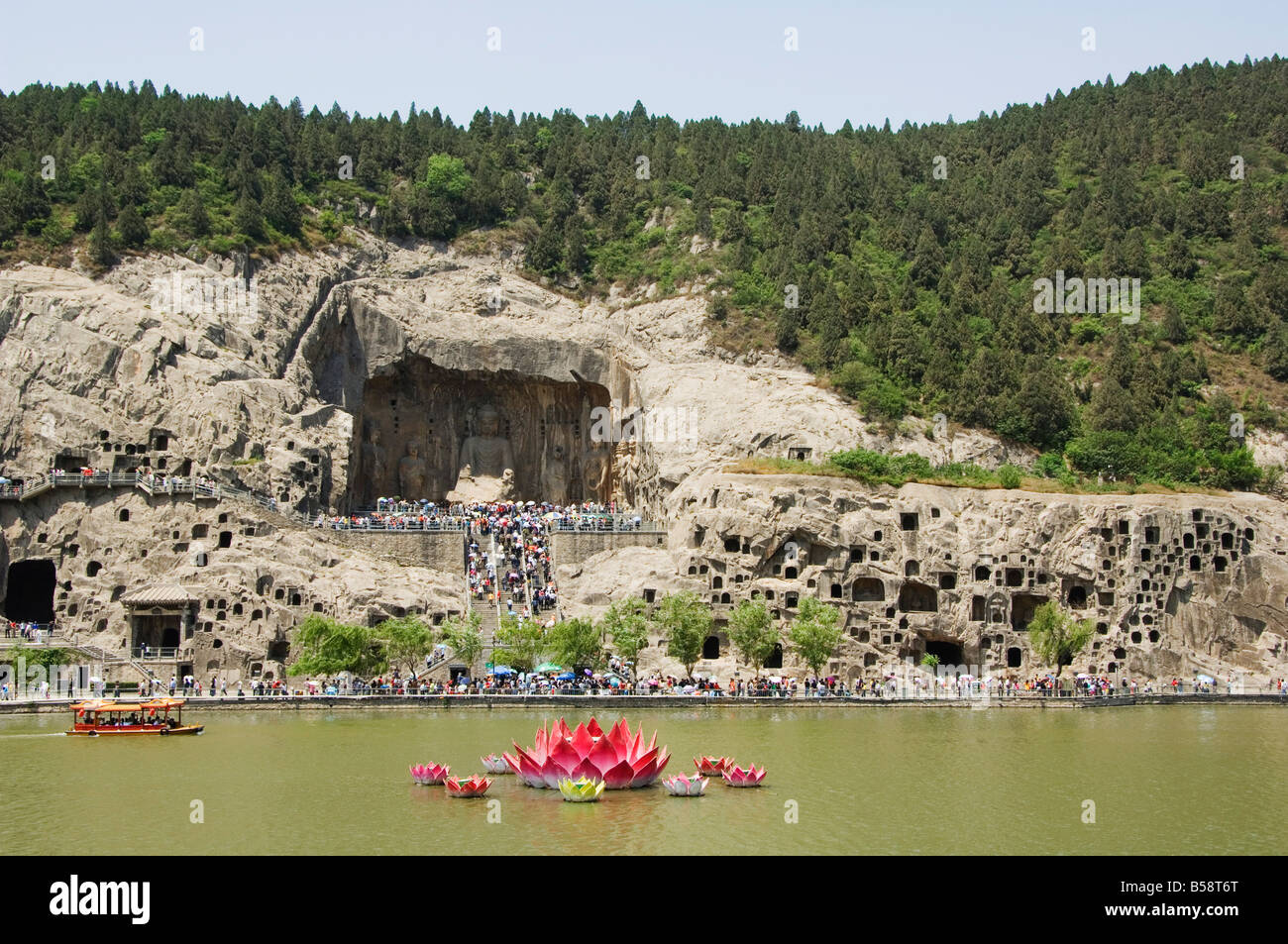 Carved Buddha images at Longmen Caves, Dragon Gate Grottoes, on the Yi ...