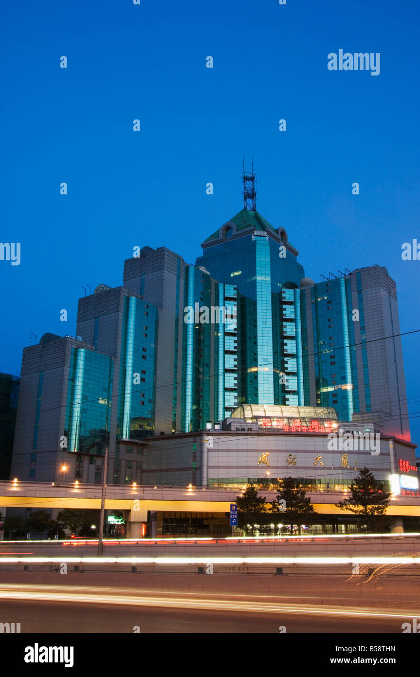 Car light trails and modern buildings near Beijing North Train Station ...