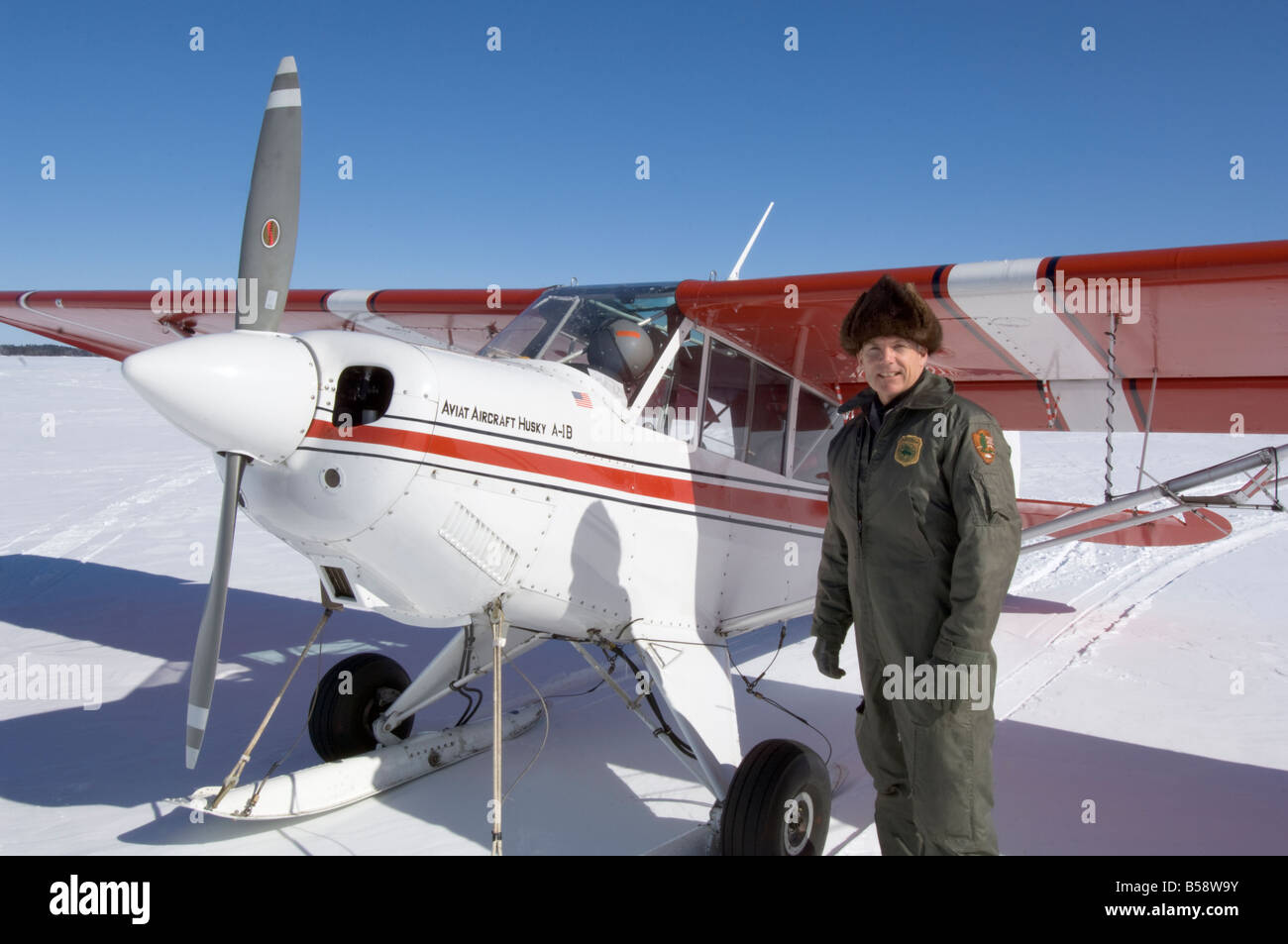 National Park Service pilot Jim Hummel in front of his plane after ...